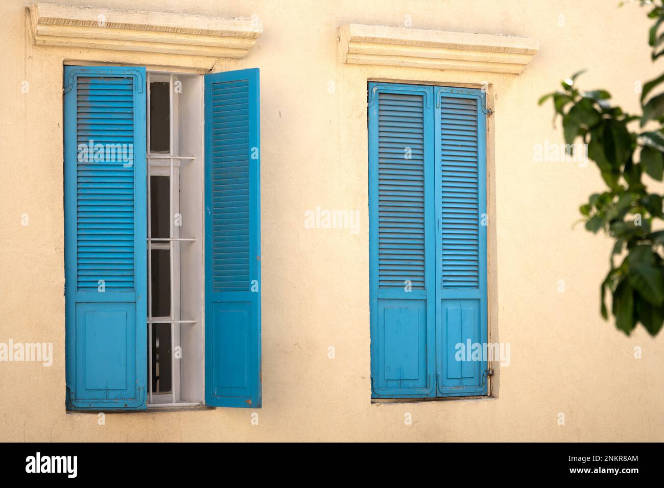 Vintage blue wooden shutters on a windows Stock Photo - Alamy