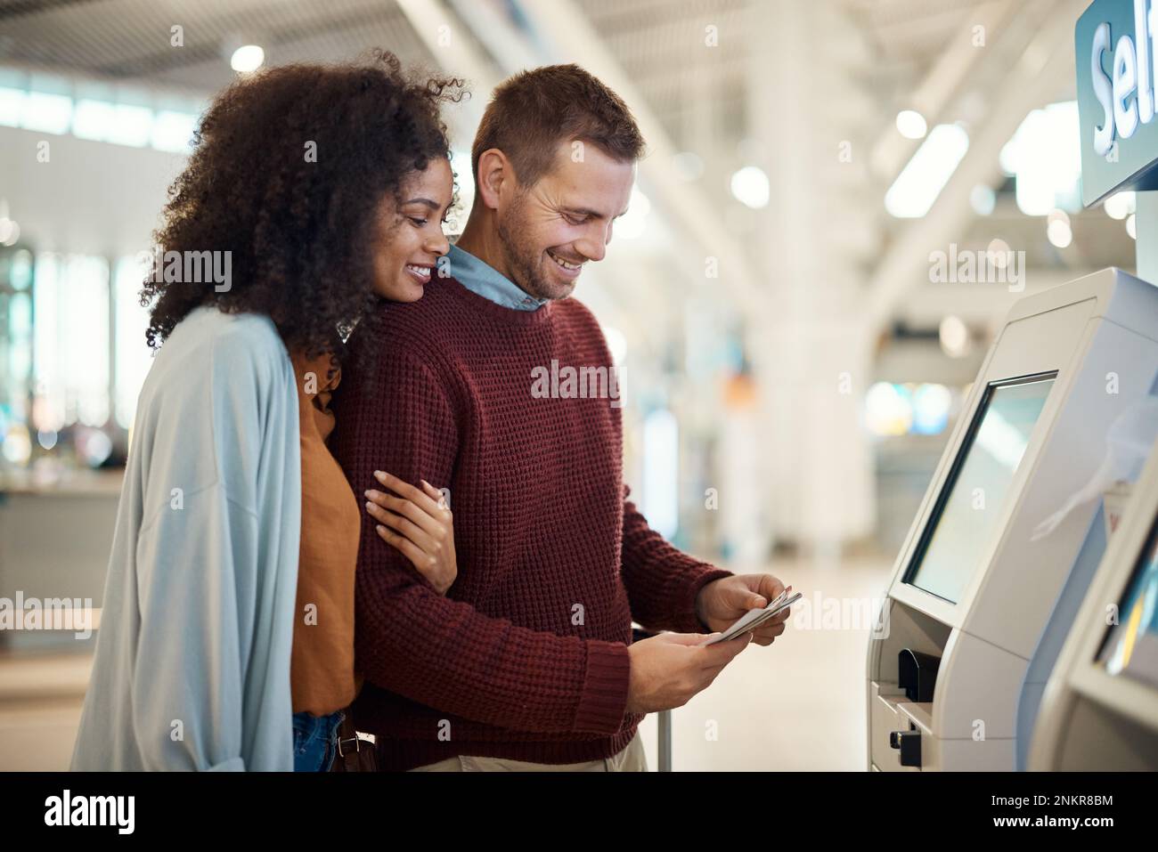 Airport, payment and couple with ticket for self service, checkout or ...