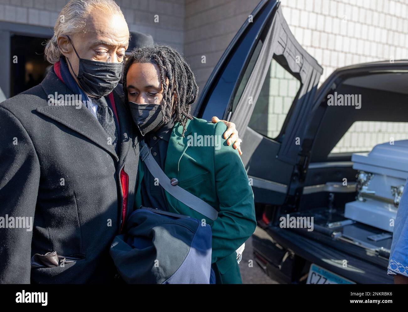 Amir Locke's brother, Andre Locke Jr., is comforted by the Rev. Al ...
