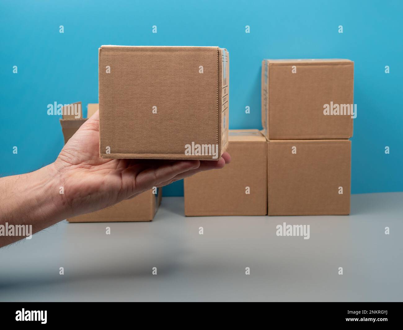 Humanitarian aid. Cardboard boxes with donations on a blue background ...