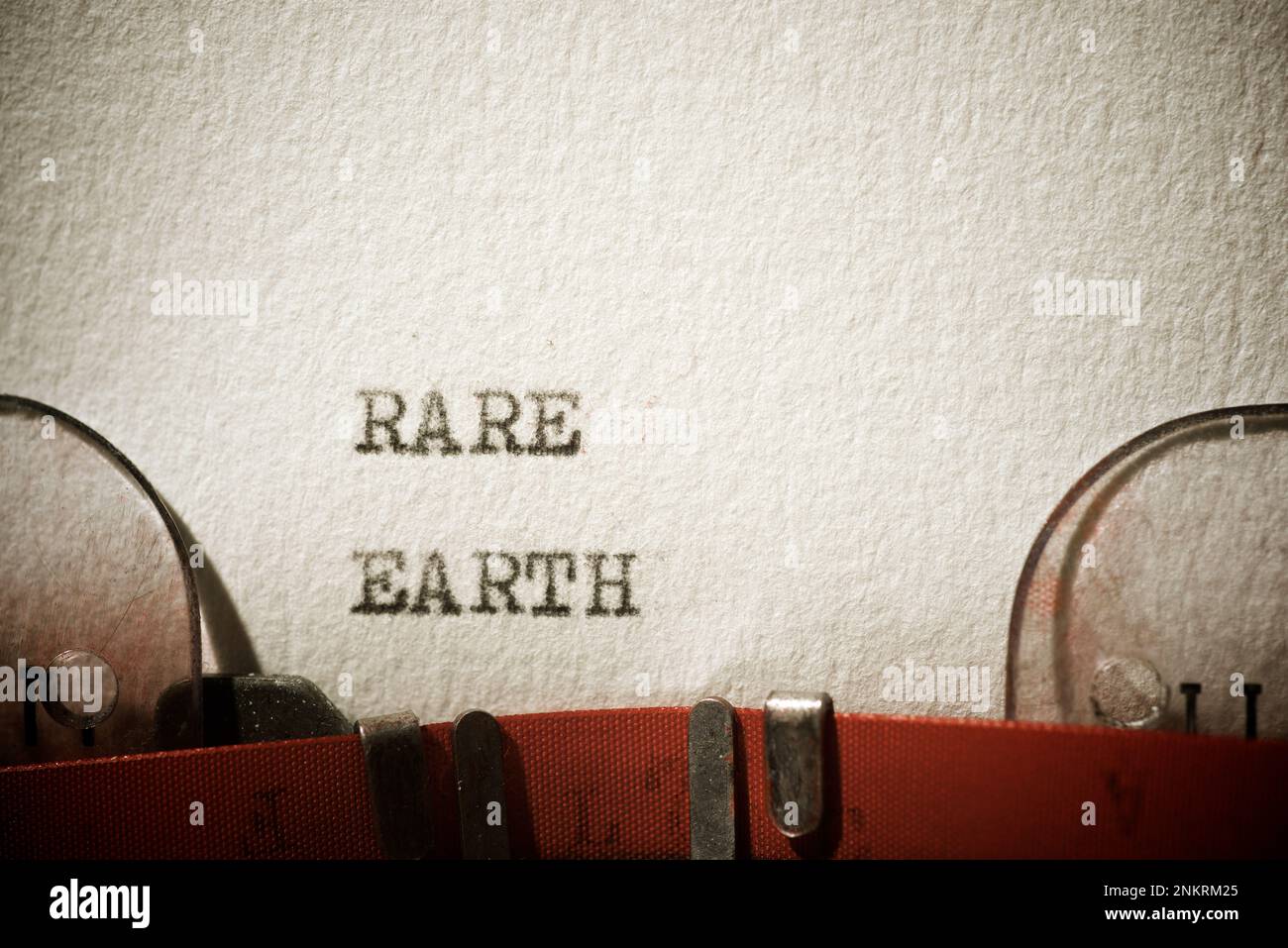 Rare earth text written with a typewriter Stock Photo - Alamy