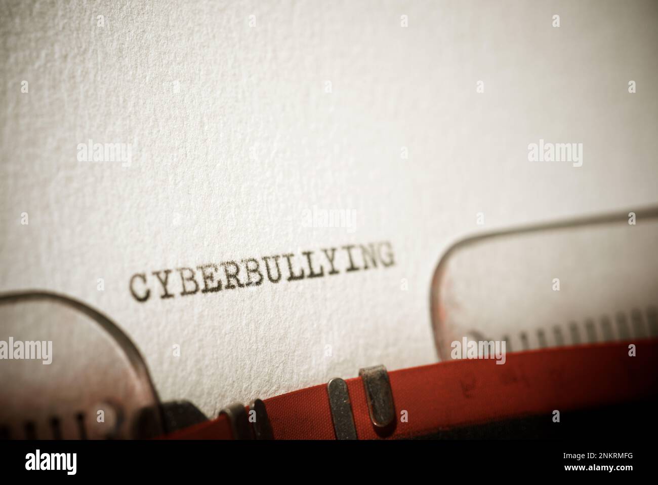 Cyberbullying word written with a typewriter Stock Photo - Alamy