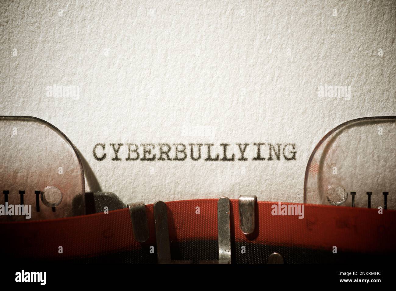 Cyberbullying word written with a typewriter Stock Photo - Alamy