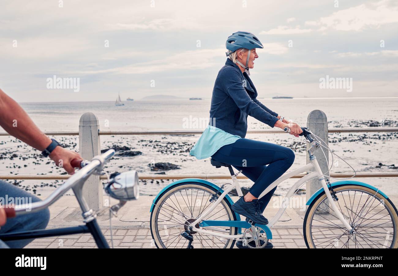 Old woman on bike at beach, fitness and cycling outdoor, vitality and ...