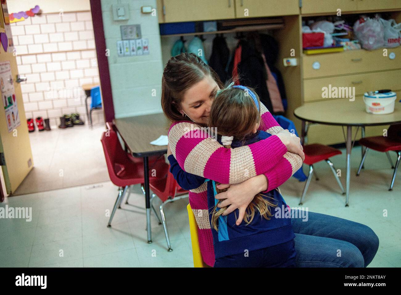 Hannah Neurohr embraces her 5-year-old daughter Ava Garcia, kissing her ...