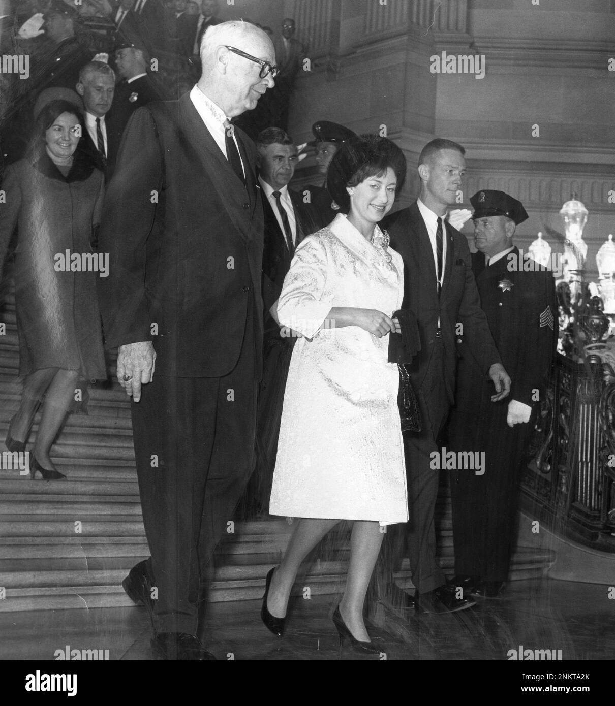 Princess Margaret smiles as she descends the steps with Mayor John F ...