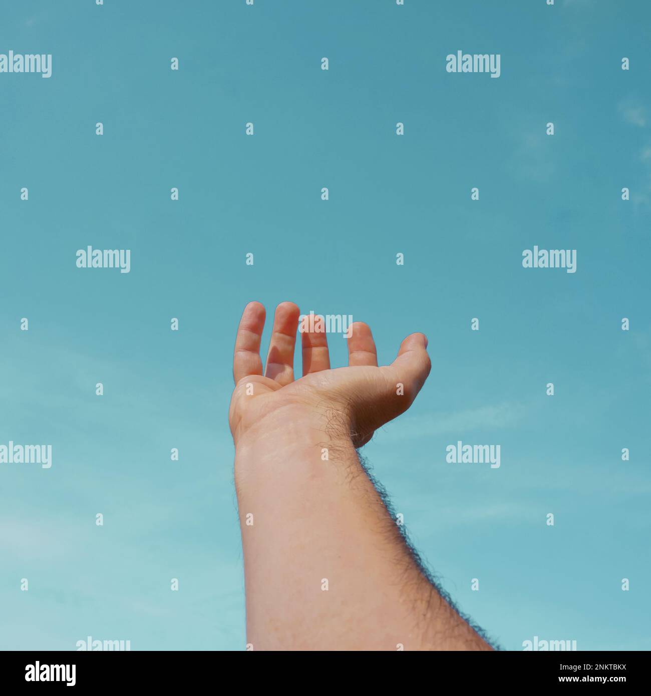 Hand reaching to sky hi-res stock photography and images - Alamy