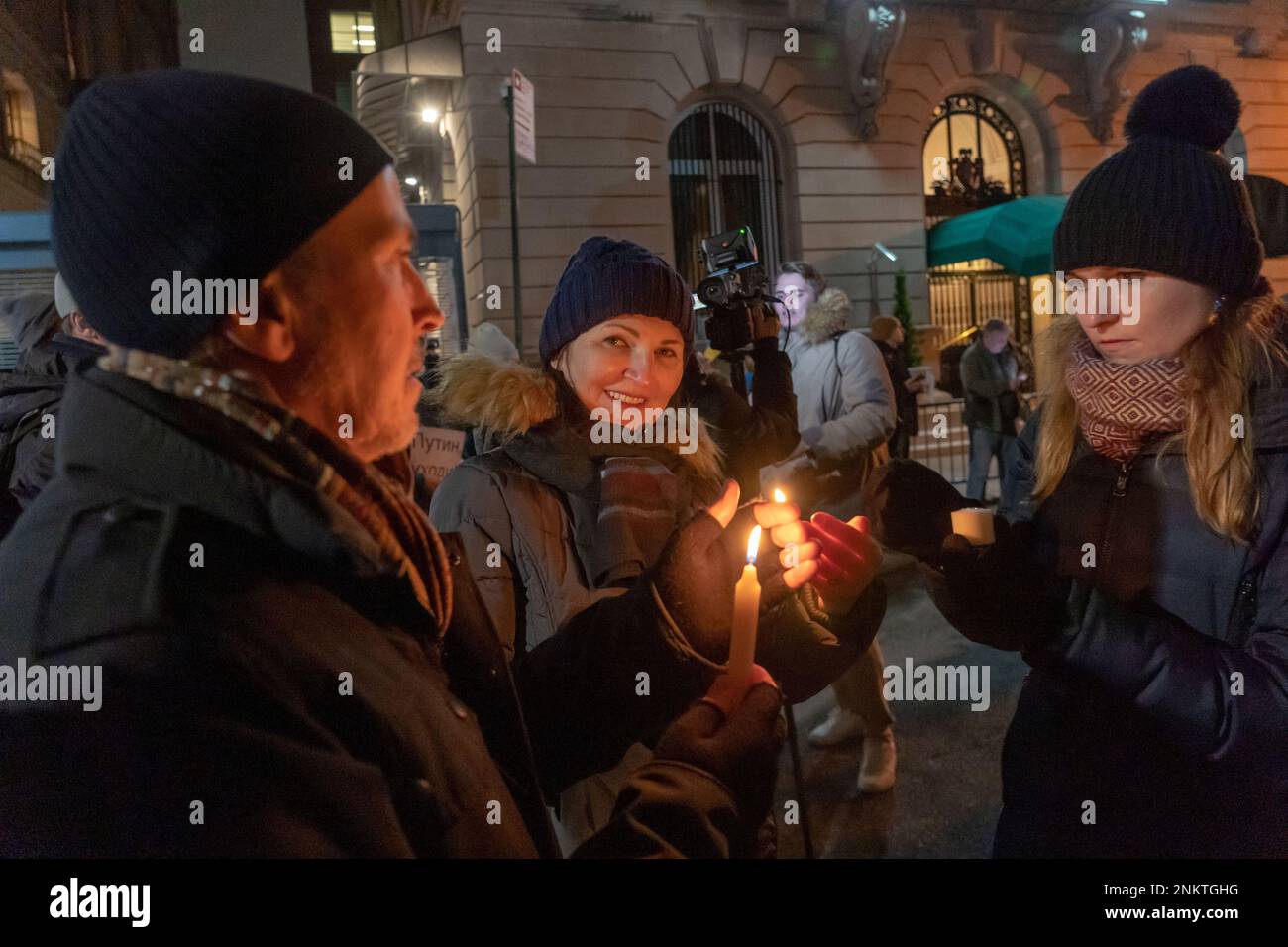 New York, United States. 23rd Feb, 2023. People light candles at a ...
