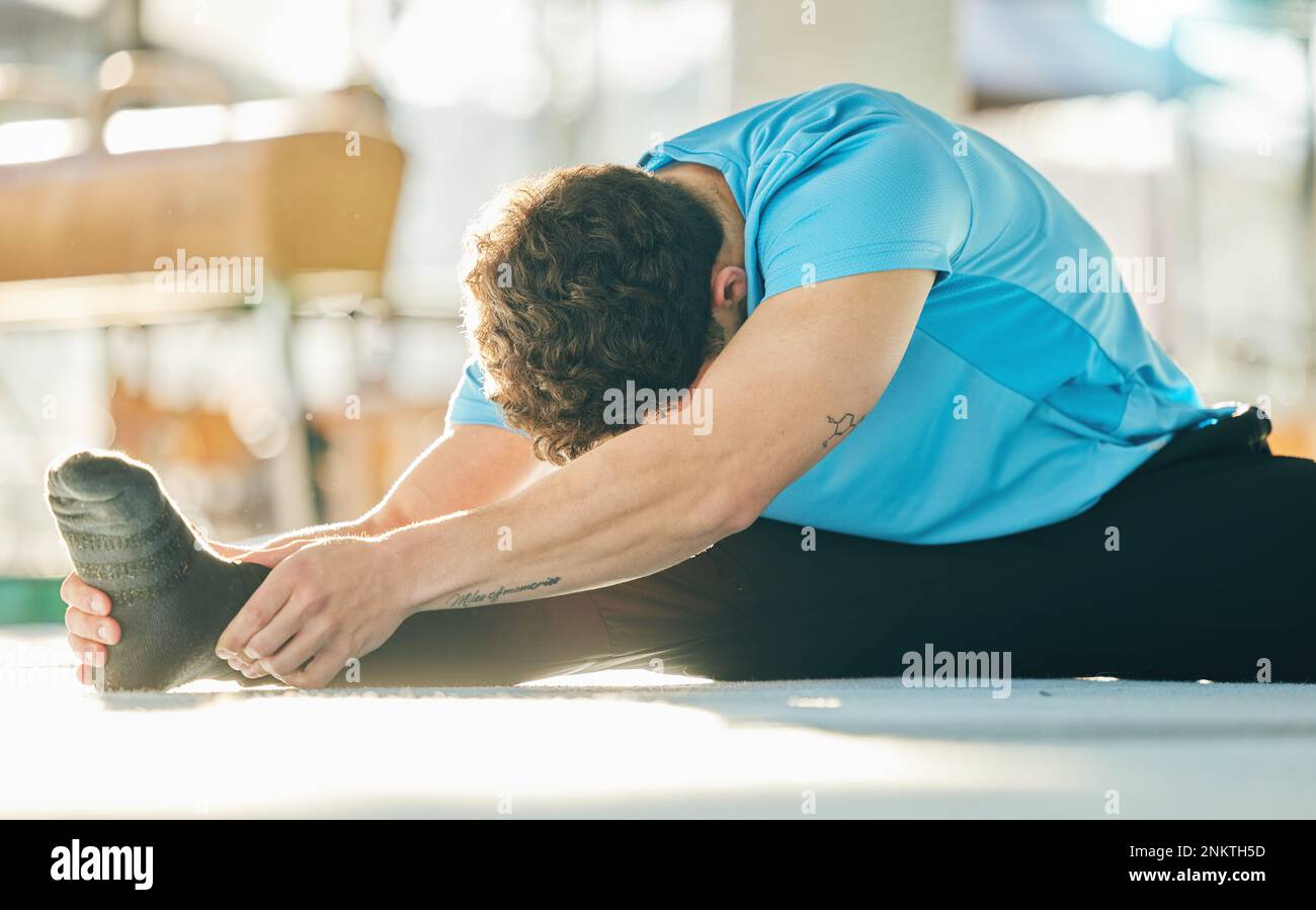 Gymnast stretching, man in gym with exercise and flexibility ...