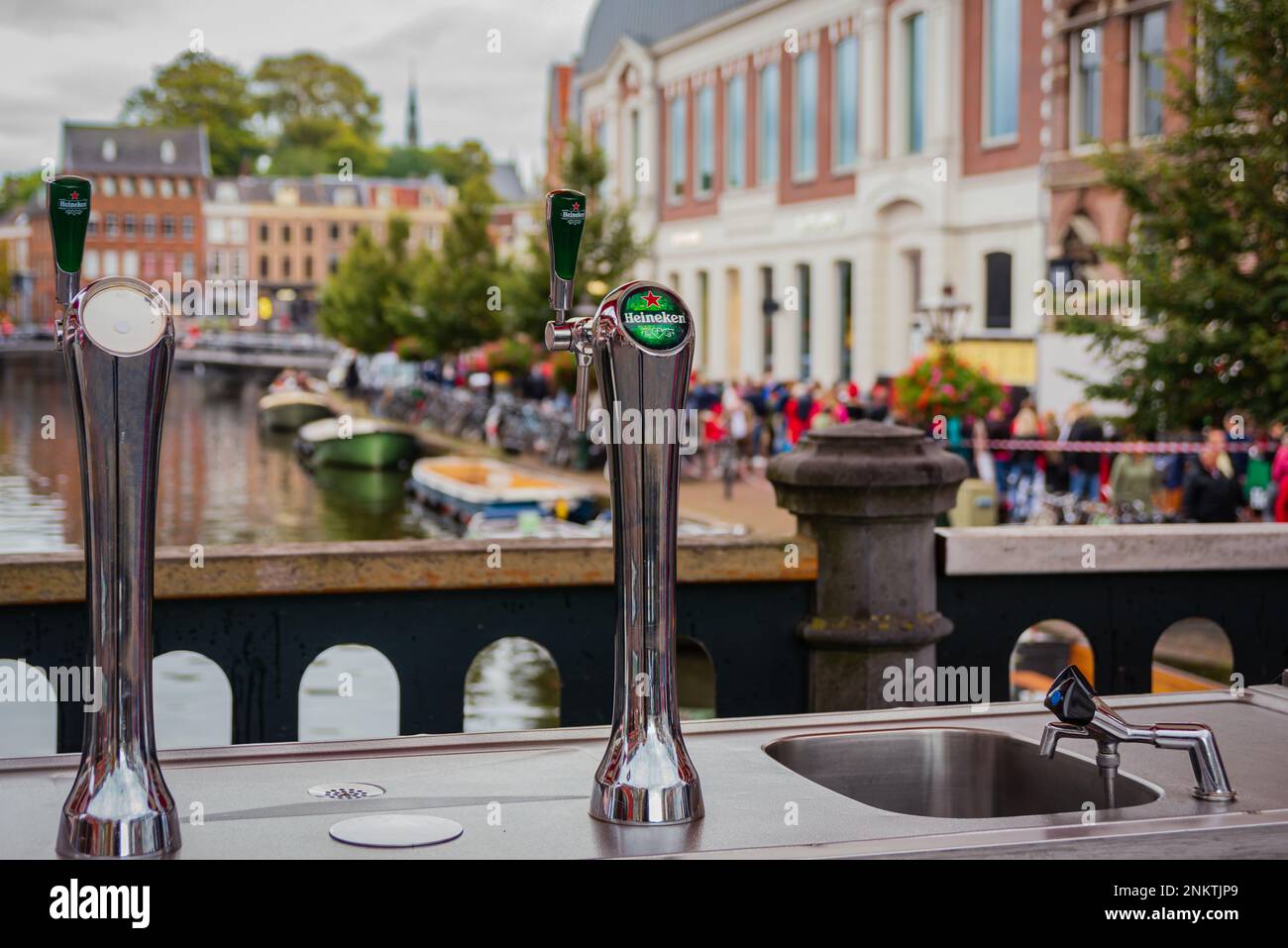 3 October 2022, Leiden, Netherlands, Heineken beer tap and blurry ...
