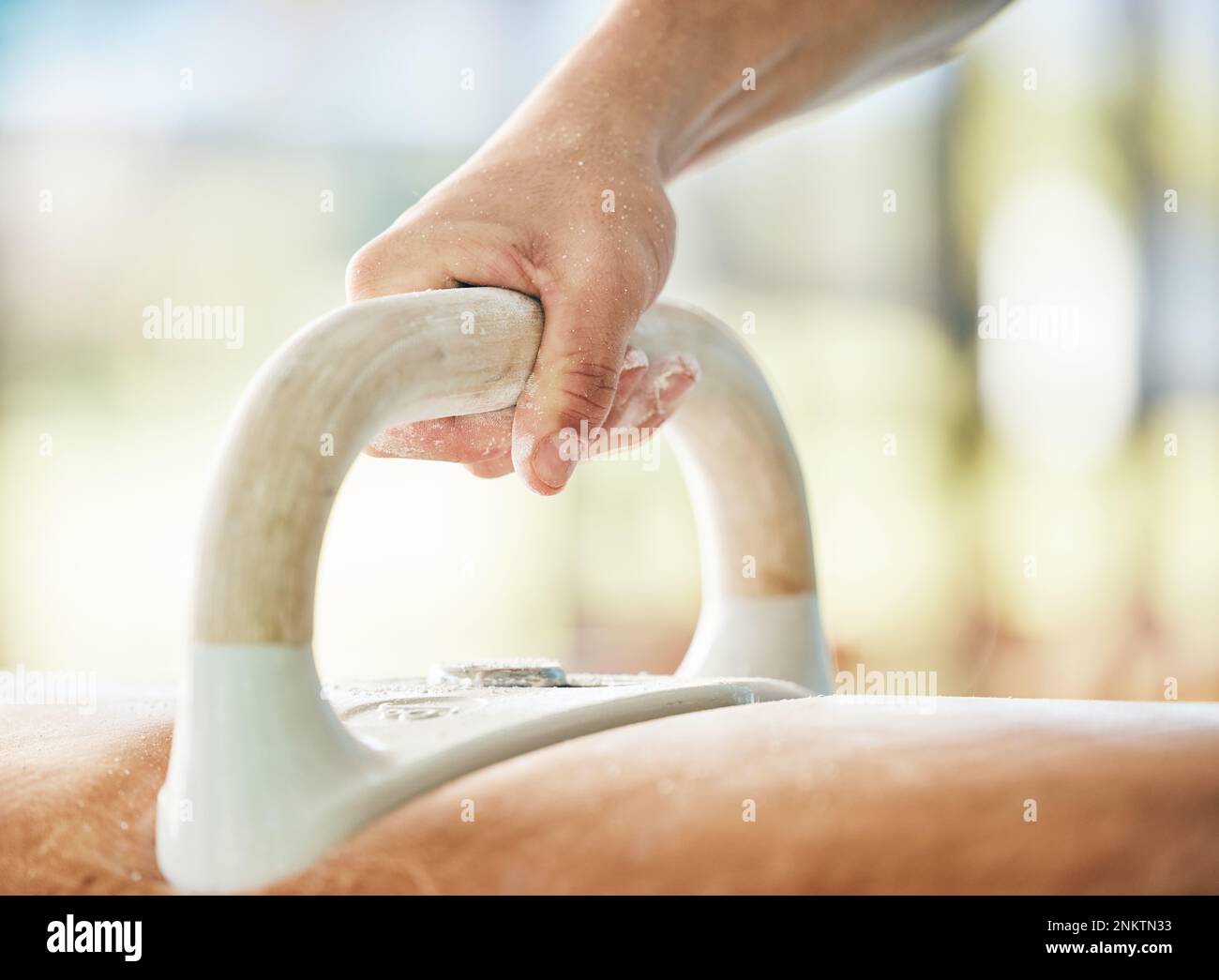 Hand, gymnastics pommel horse and handle in gym, fitness zoom with ...