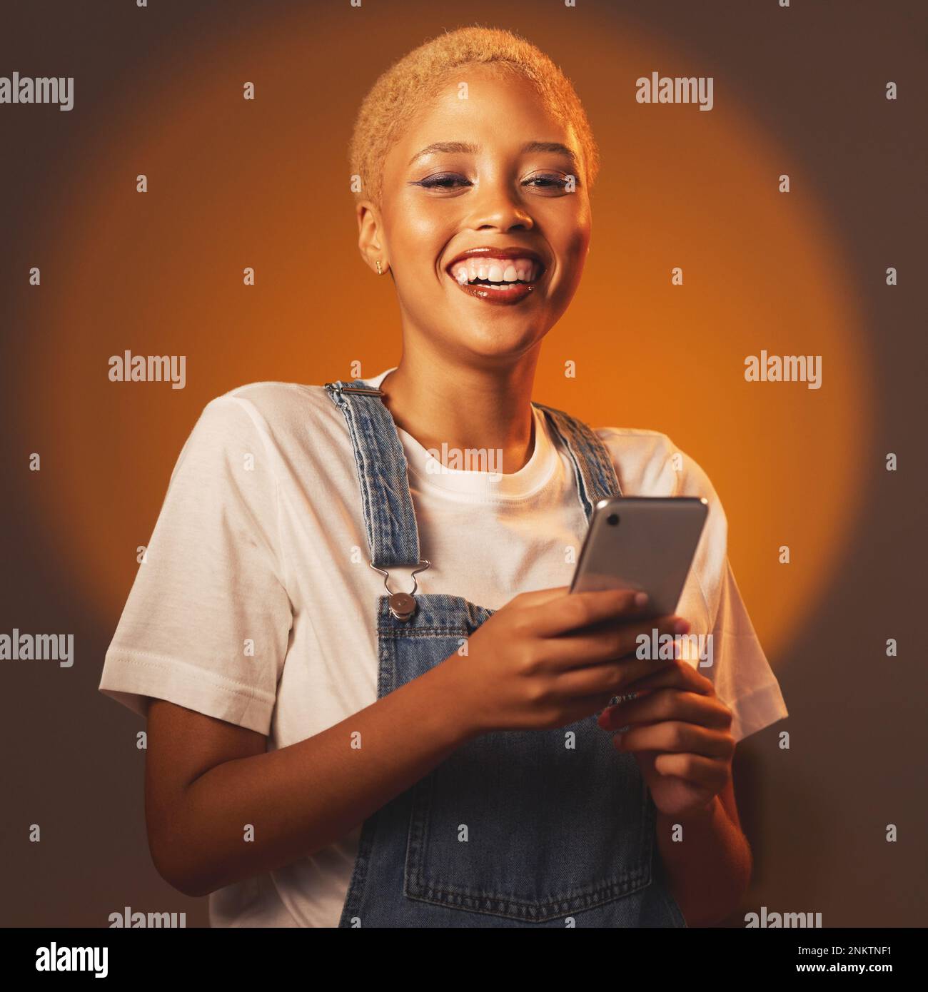 Portrait of black woman, smile and phone, typing message or email and ...
