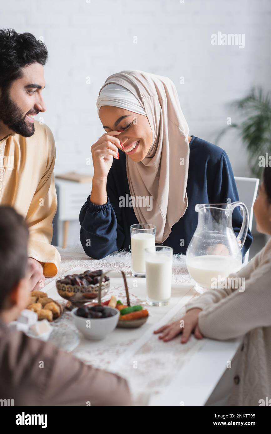 positive muslim family having breakfast during ramadan at home,stock ...