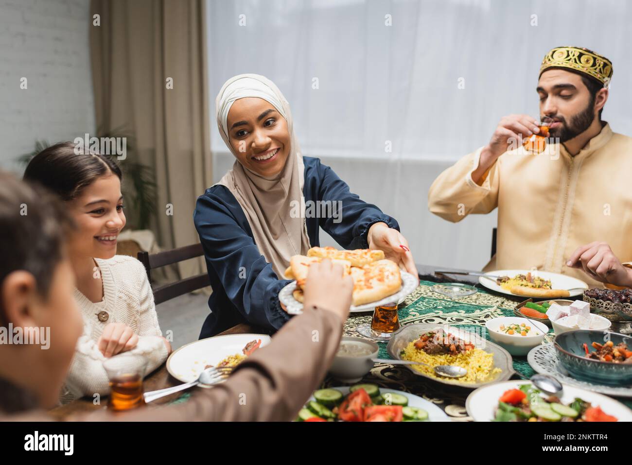 Middle eastern family having iftar dinner during ramadan,stock image Stock Photo - Alamy