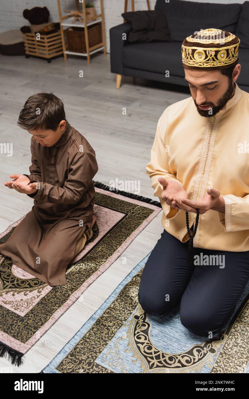 Muslim father and son prayer hi-res stock photography and images - Alamy