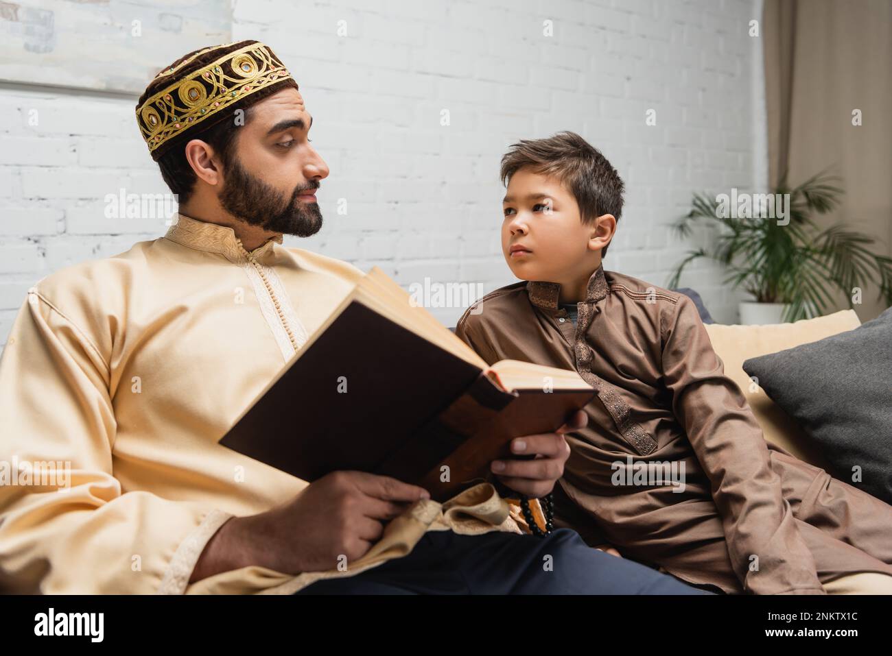 Middle eastern father book child hi-res stock photography and images ...