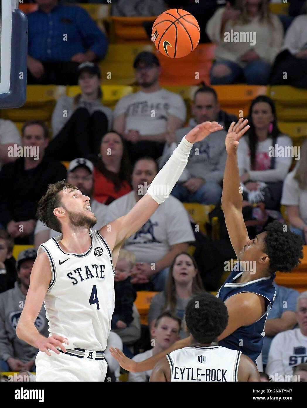 Nevada guard Grant Sherfield shoots as Utah State forward Brandon ...