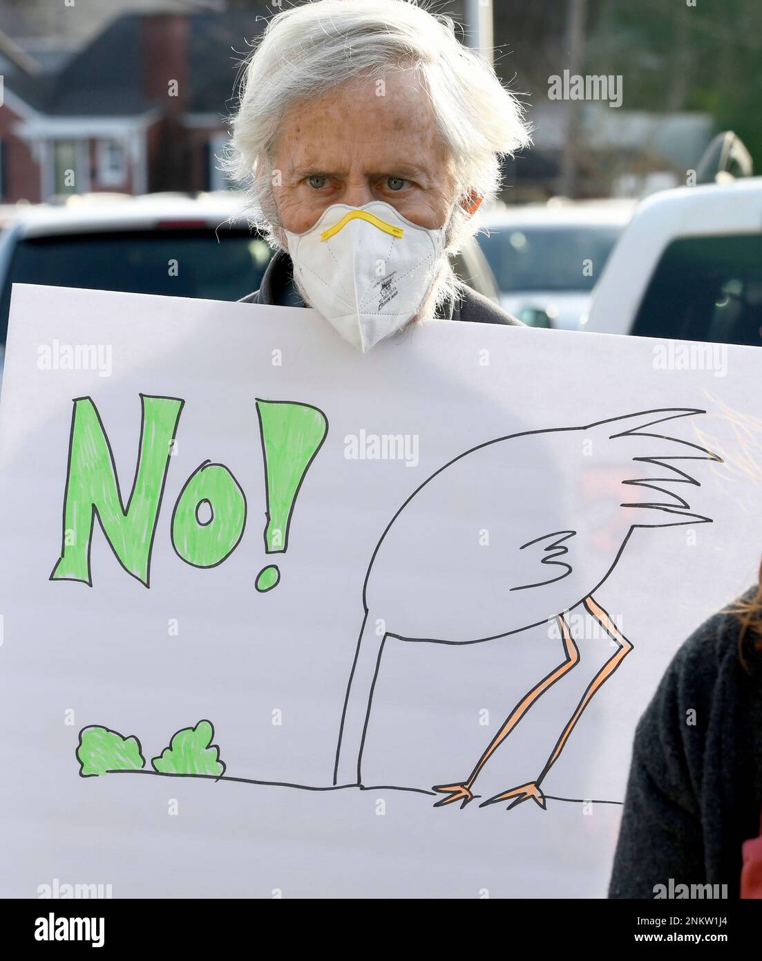 A man carries a sign critical of the McMinn County School Board ...