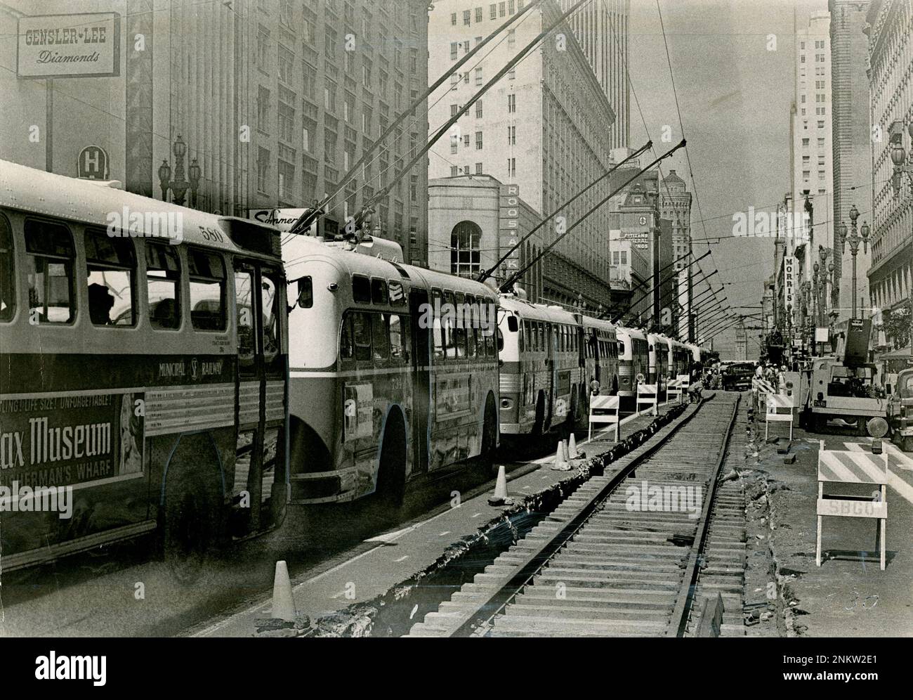 1960's: San Francisco Muni trolley buses stalled on Market Street, near ...