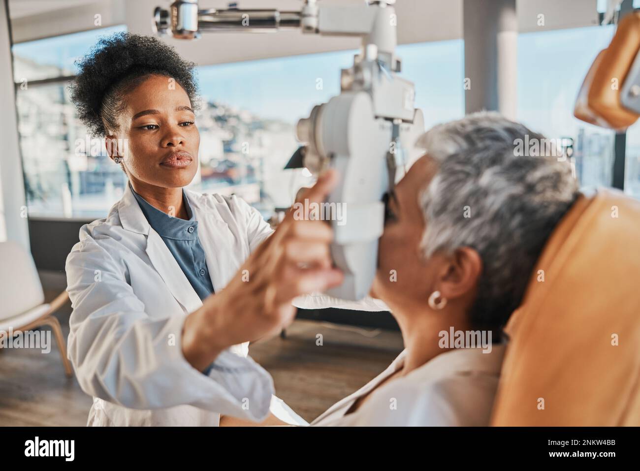 Eye exam, vision and black woman with patient in optometry clinic for ...