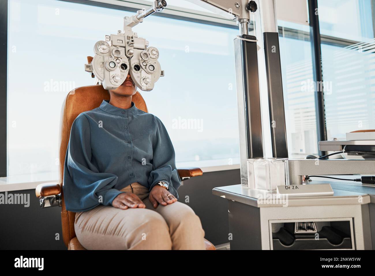 Ophthalmologist phoropter, patient consulting or eye exam for vision ...