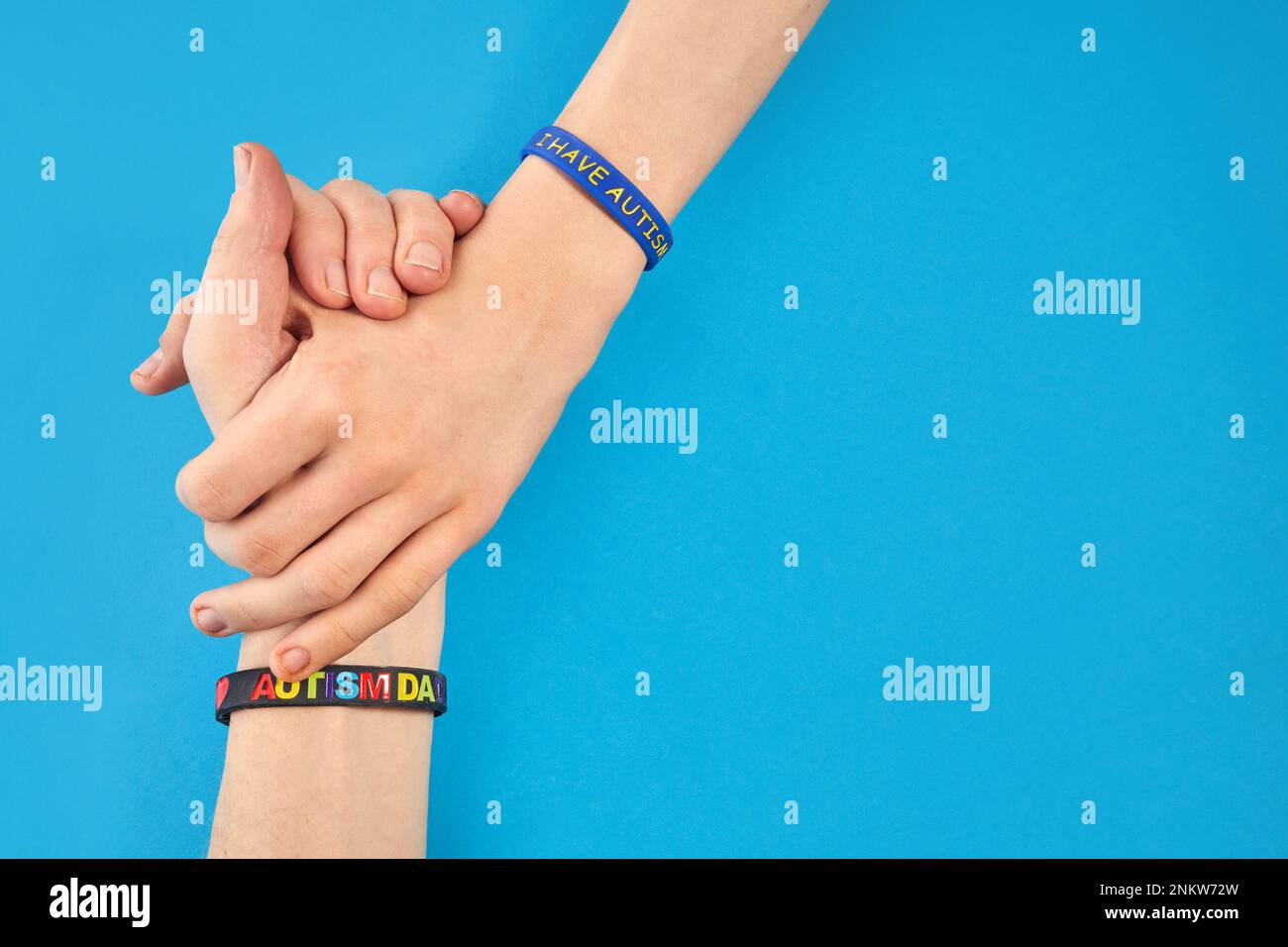 Autism Awareness. Autism father holding hand his Autistic Child with I ...