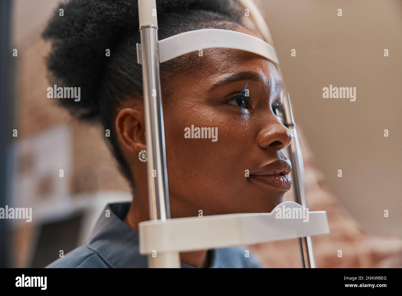 Laser, vision or black woman in eye exam for eyesight at optometrist or ...