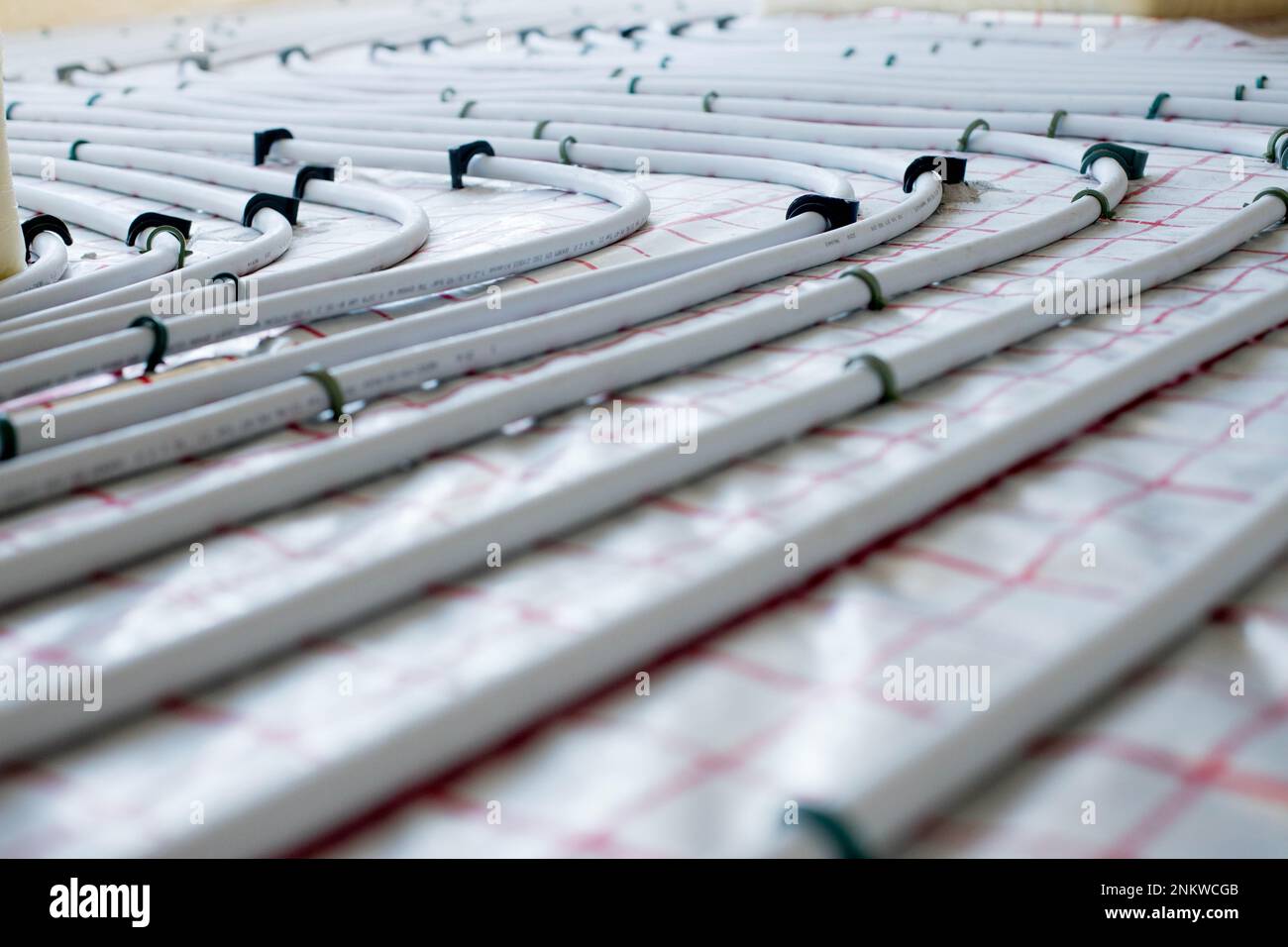 Installation of underfloor heating pipes for water heating. Heating systems. Pipes for ...