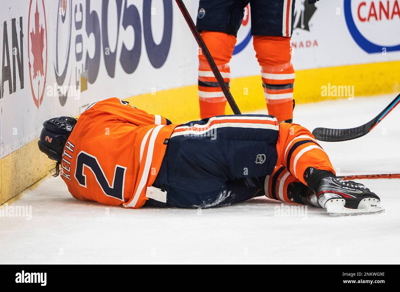 Edmonton Oilers Duncan Keith lies on the ice with an injury during the ...