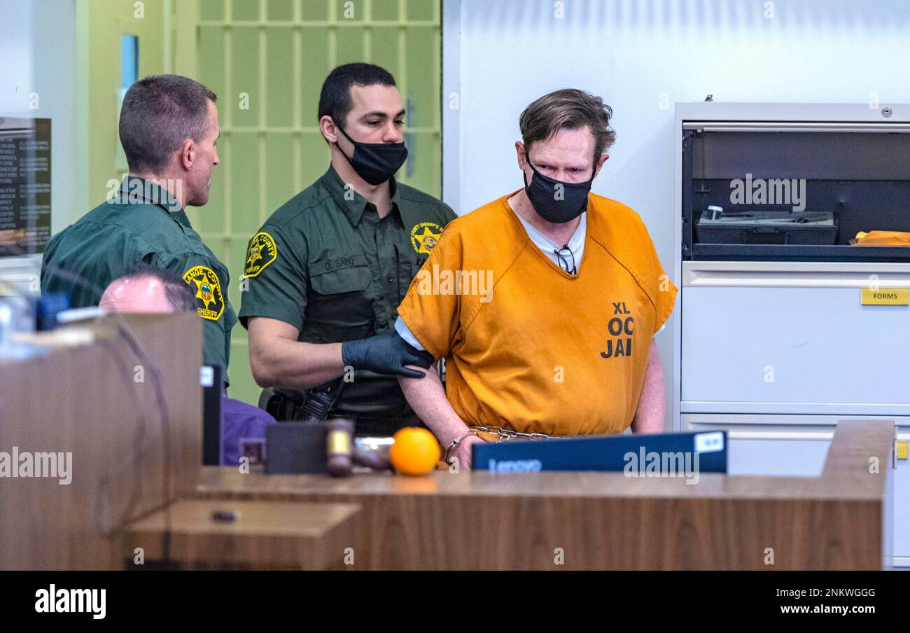 Peter Chadwick, left, a Newport Beach millionaire, sits next to his ...
