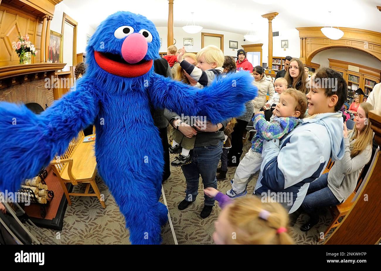 FILE - Sesame Street character Grover reaches out to hug children after ...