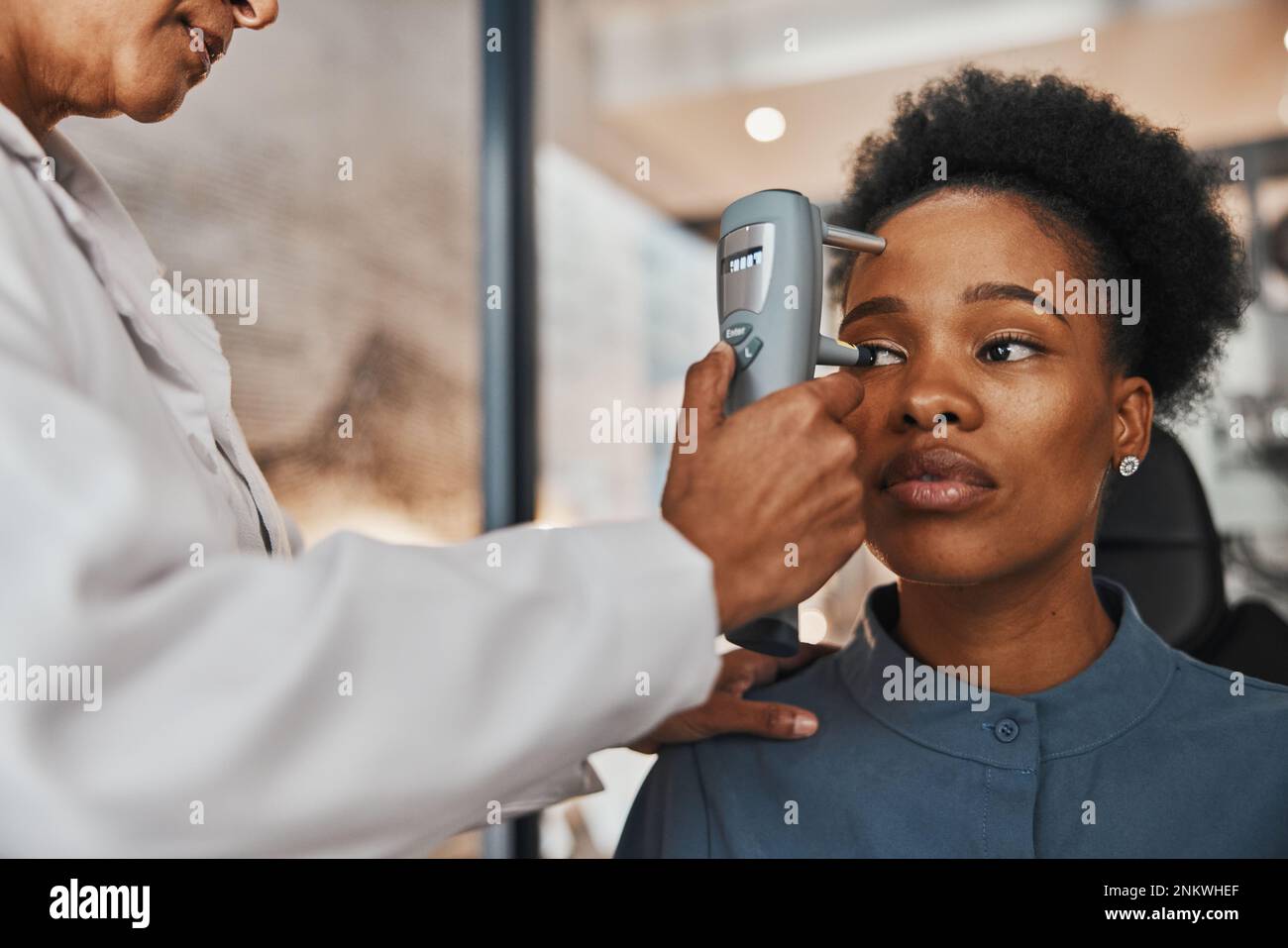 Face, eye exam or black woman consulting doctor for eyesight at ...