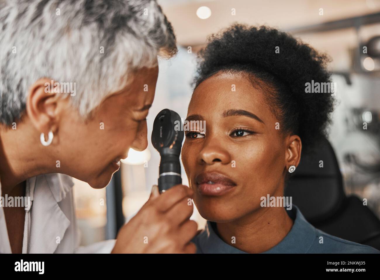Laser, senior doctor or black woman in eye exam for eyesight at ...