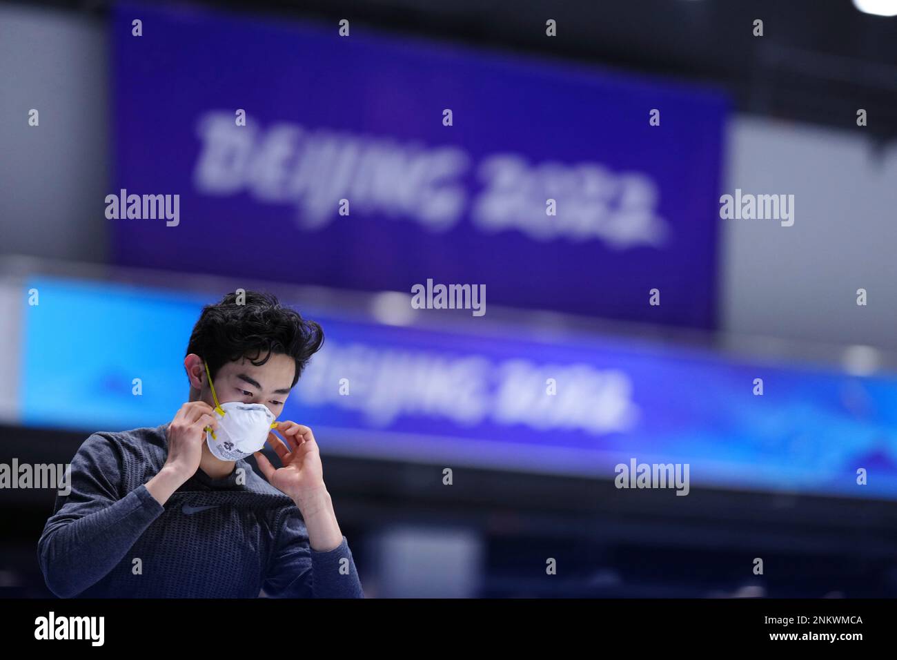 USA's Nathan Chen wears a mask during the practice in Beijing, China on ...