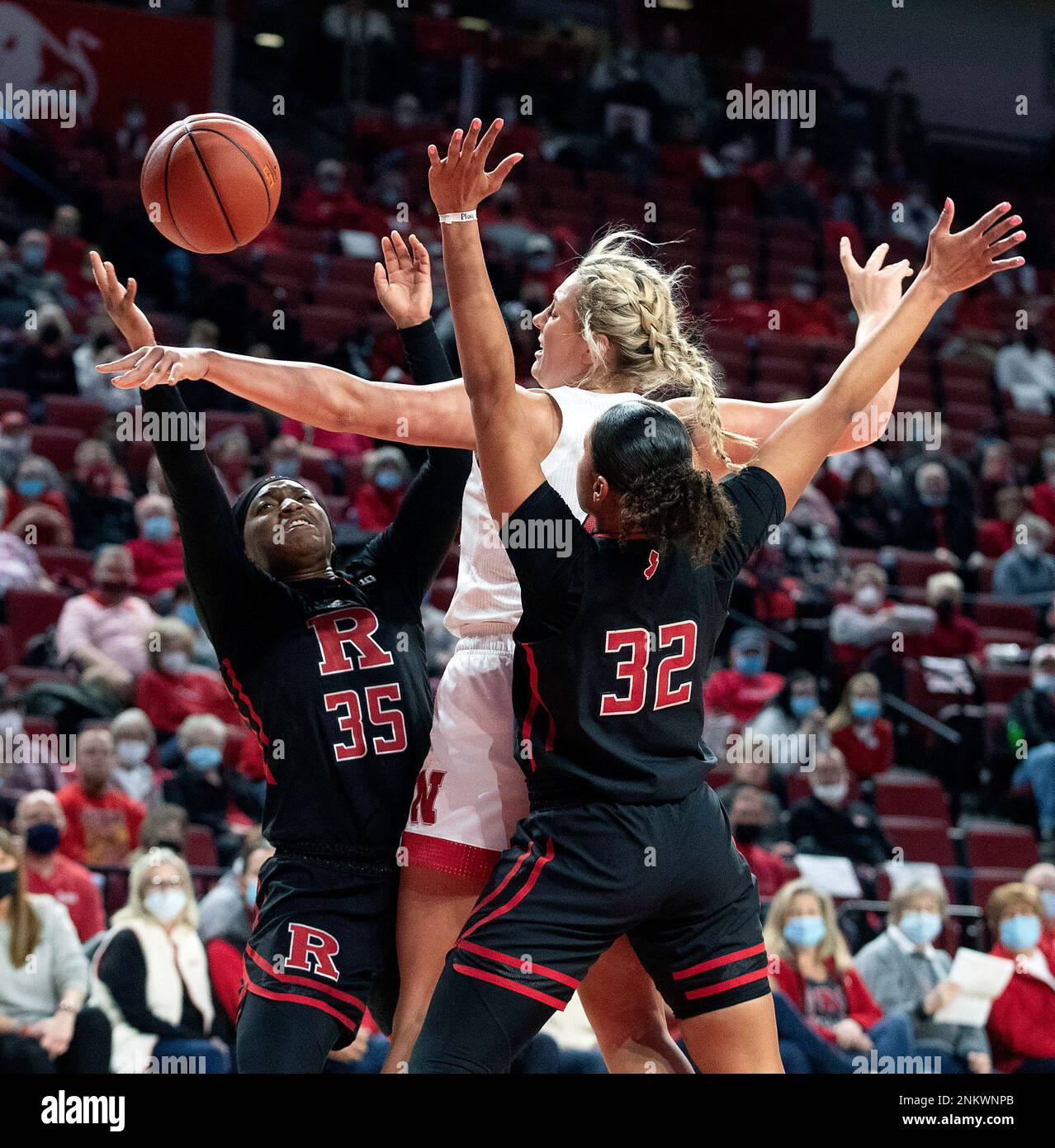 Nebraska's Alexis Markowski (center) battles Rutgers' Sayawni Lassiter ...