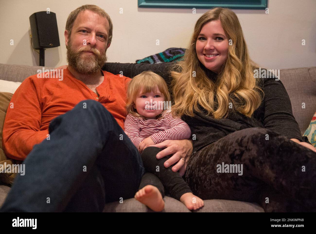 Charlie Paulson, Ashley Summers and their daughter Alice, 2, pose for a ...