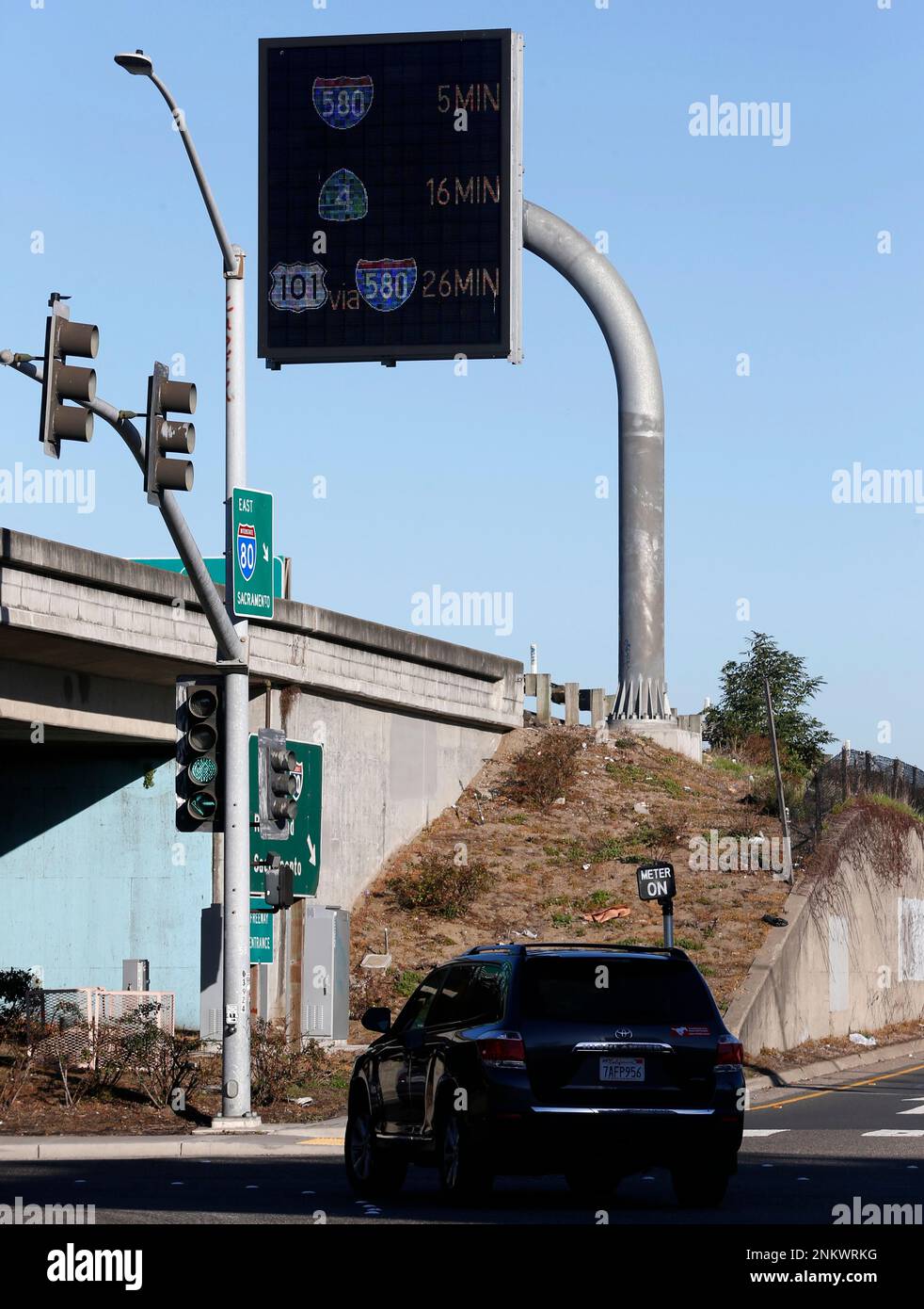 A large electronic message board displays travel times to freeway ...
