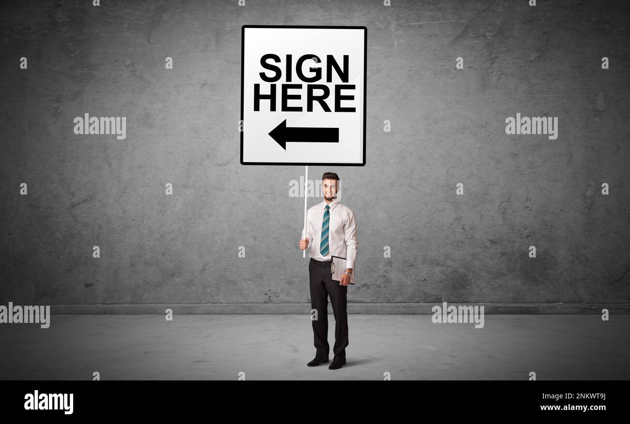 business person holding a traffic sign Stock Photo - Alamy