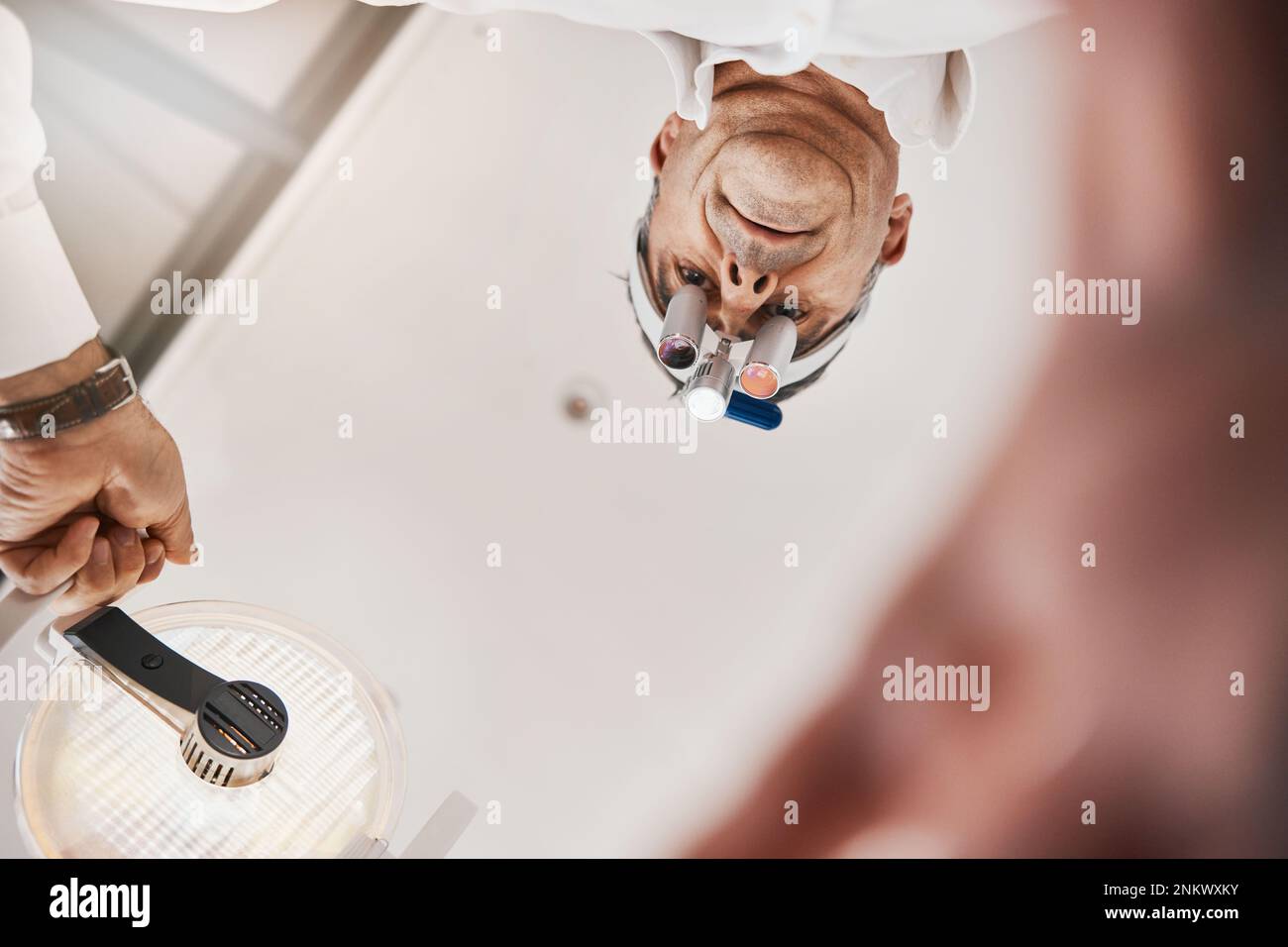 Optometry, below and a doctor with a light for a checkup, eye and ...