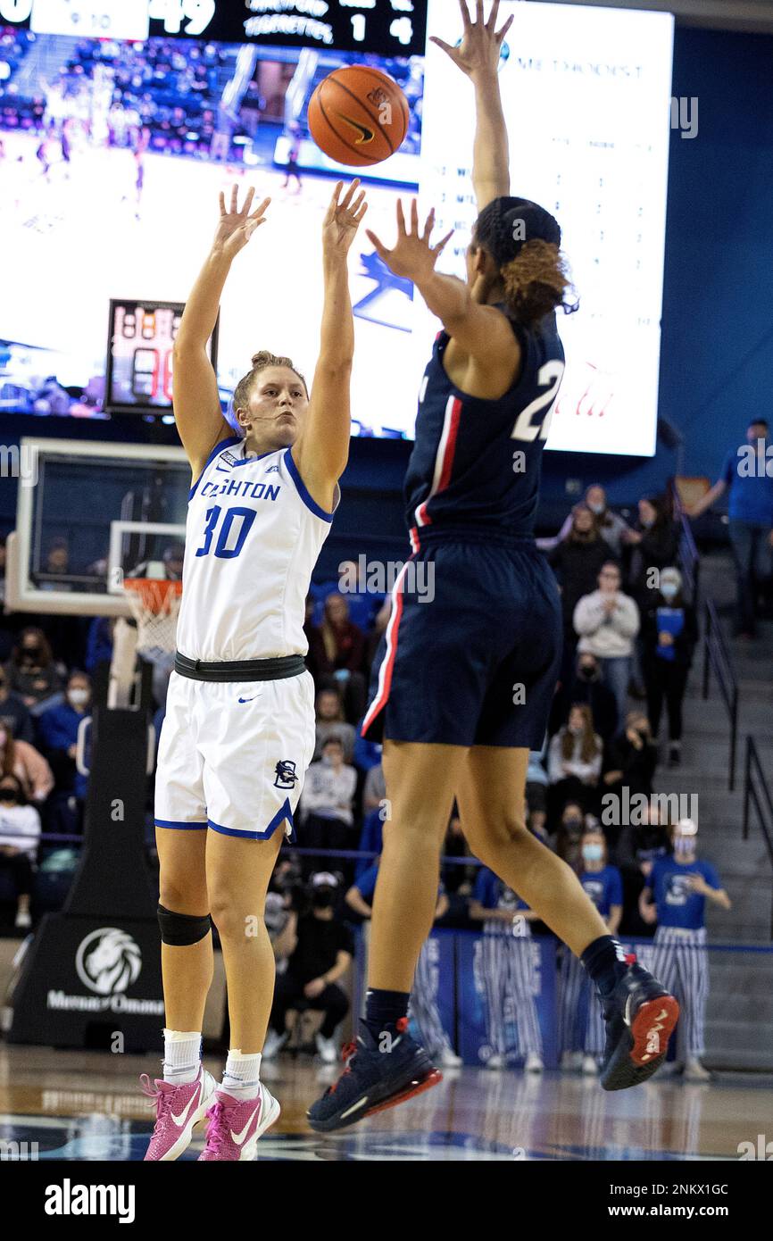 Creighton's Morgan Maly, left, shoots during their game against UConn ...