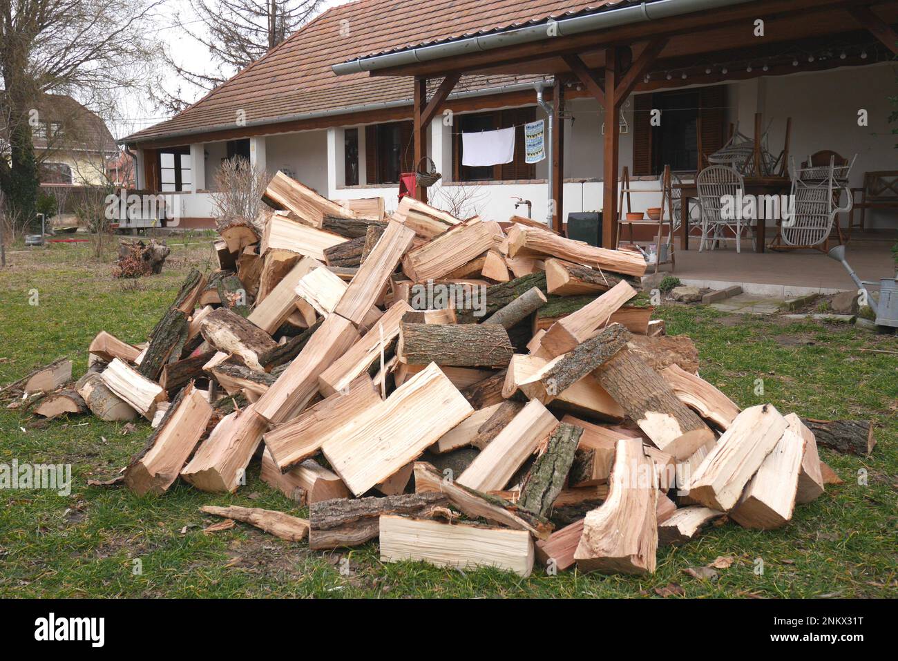Delivery of split oak and ash logs for burning in the garden of a ...