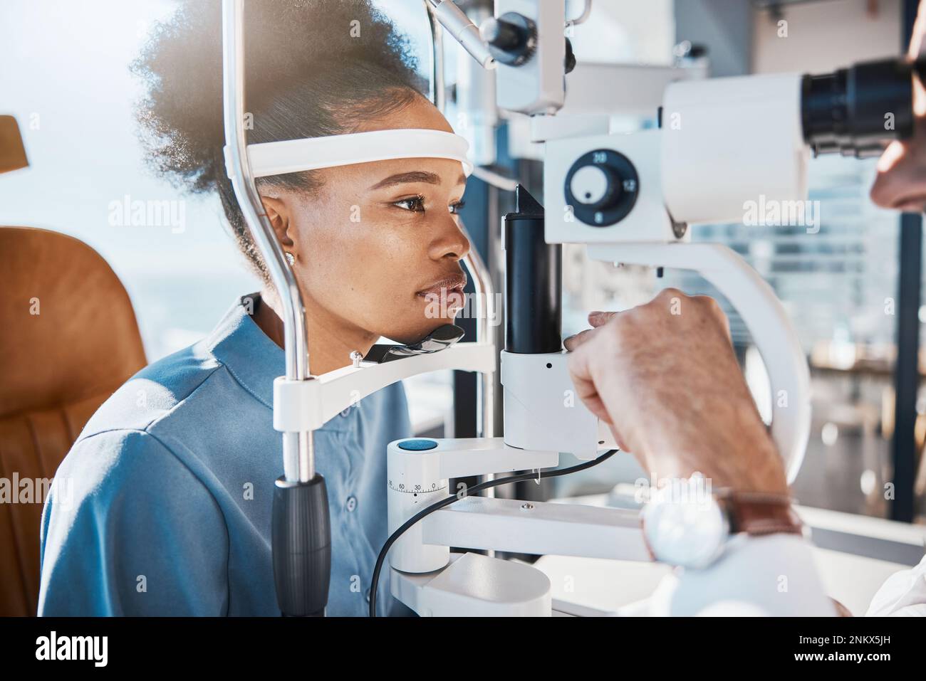 Eye exam or black woman consulting doctor for eyesight at optometrist ...