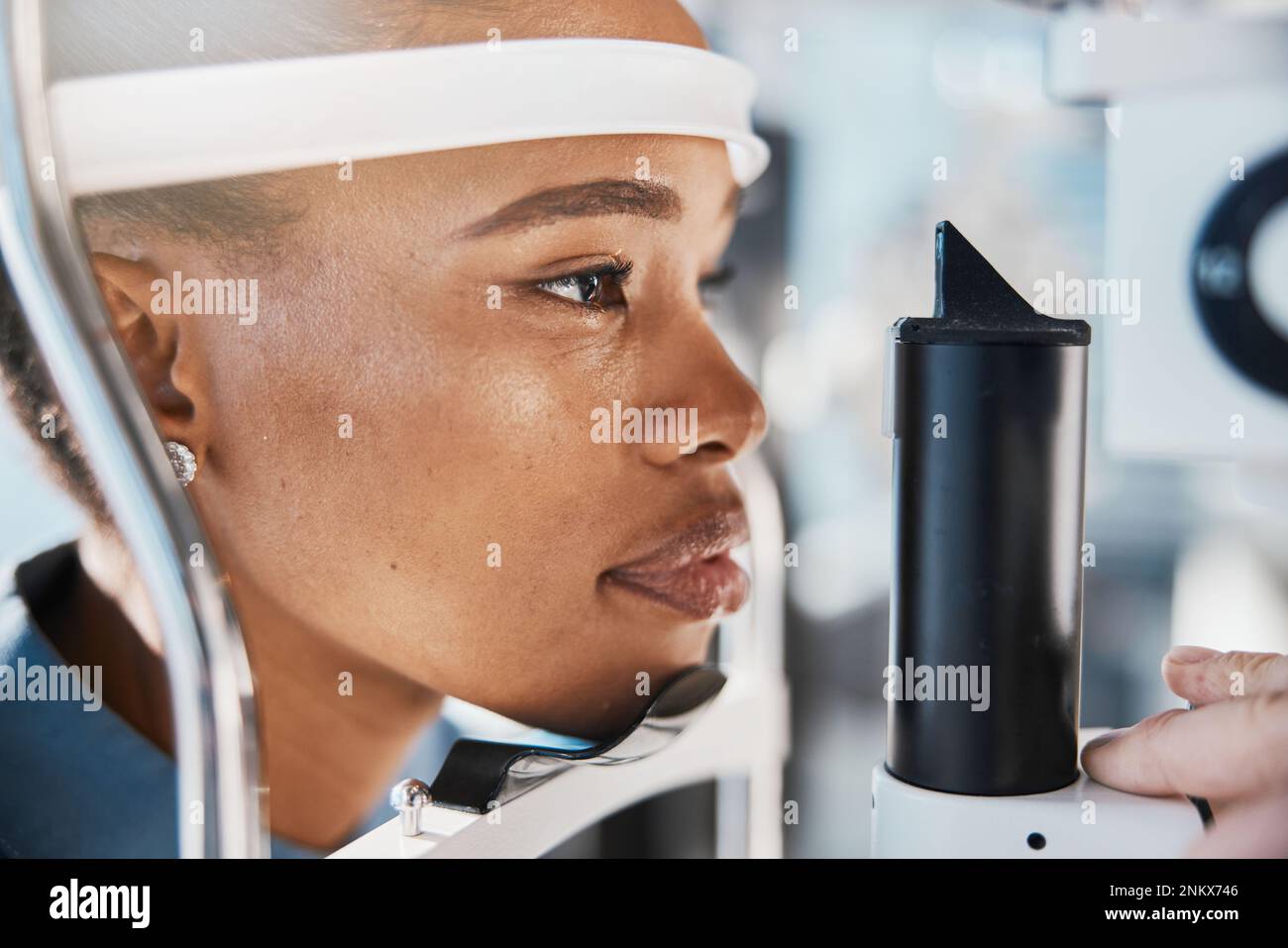 Ophthalmology, eyecare and woman doing eye test at a clinic for optic ...