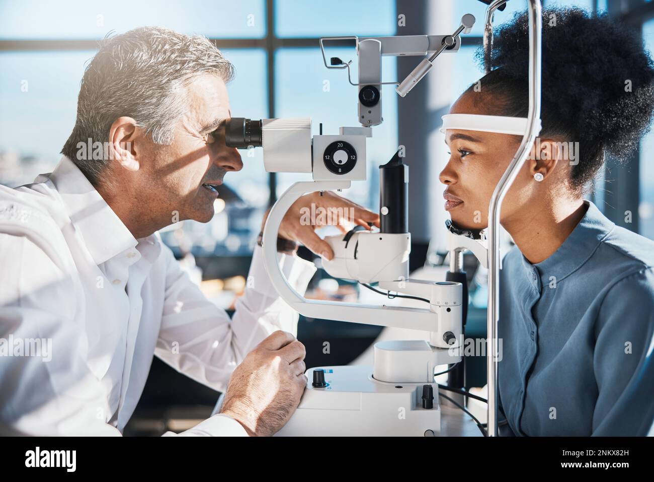 Test, eye exam or black woman consulting doctor for eyesight at ...