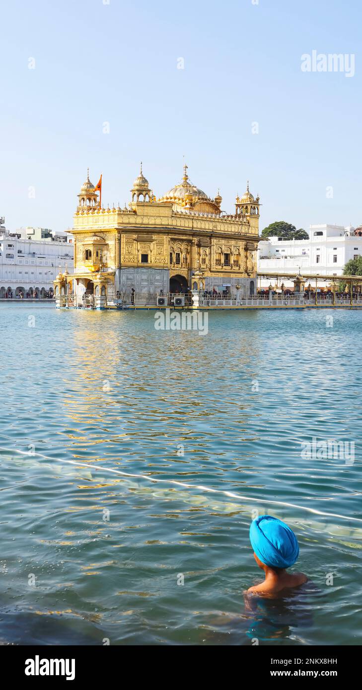 INDIA, PUNJAB, AMRITSAR, December 2022, Devotee bathing in lake at ...