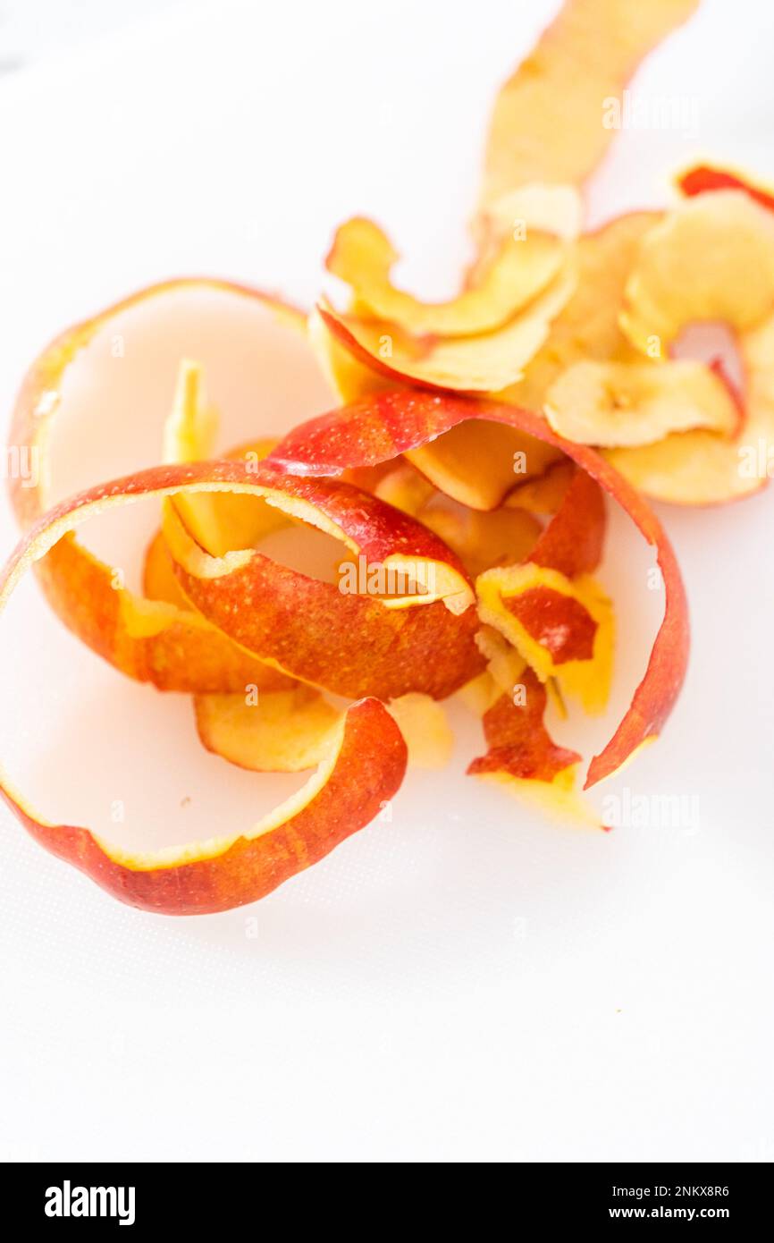 Peeling red apples Stock Photo - Alamy