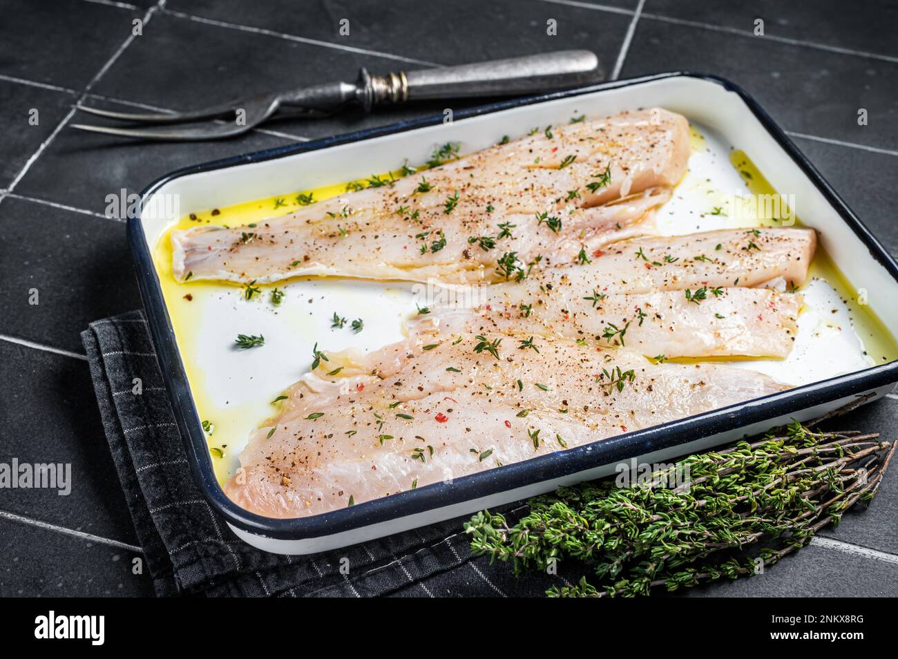 Marinated ocean red perch fillet with olive oil, thyme and spices ...