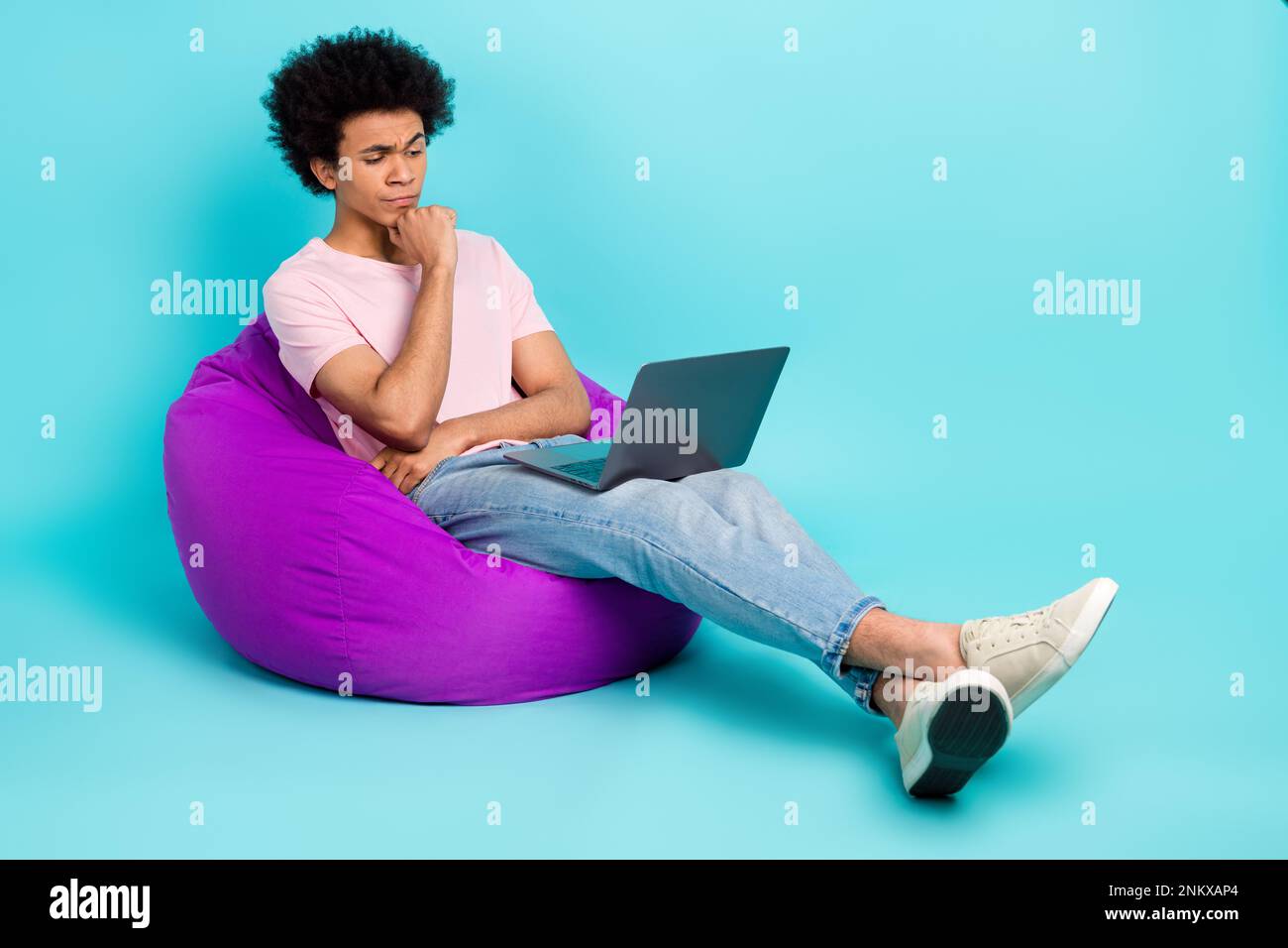 Full body photo of smart clever man student thoughtful look his netbook ...