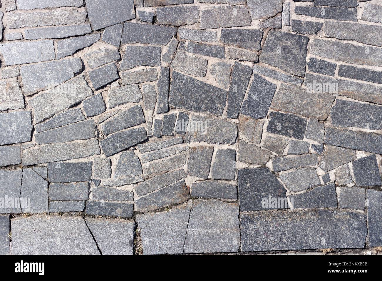 The polished pieces of gray granite paved road Stock Photo - Alamy