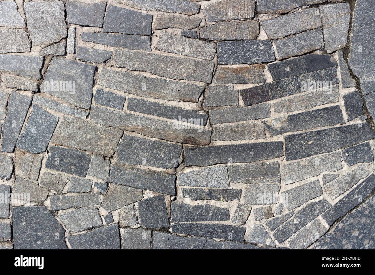 The polished pieces of gray granite paved road Stock Photo - Alamy